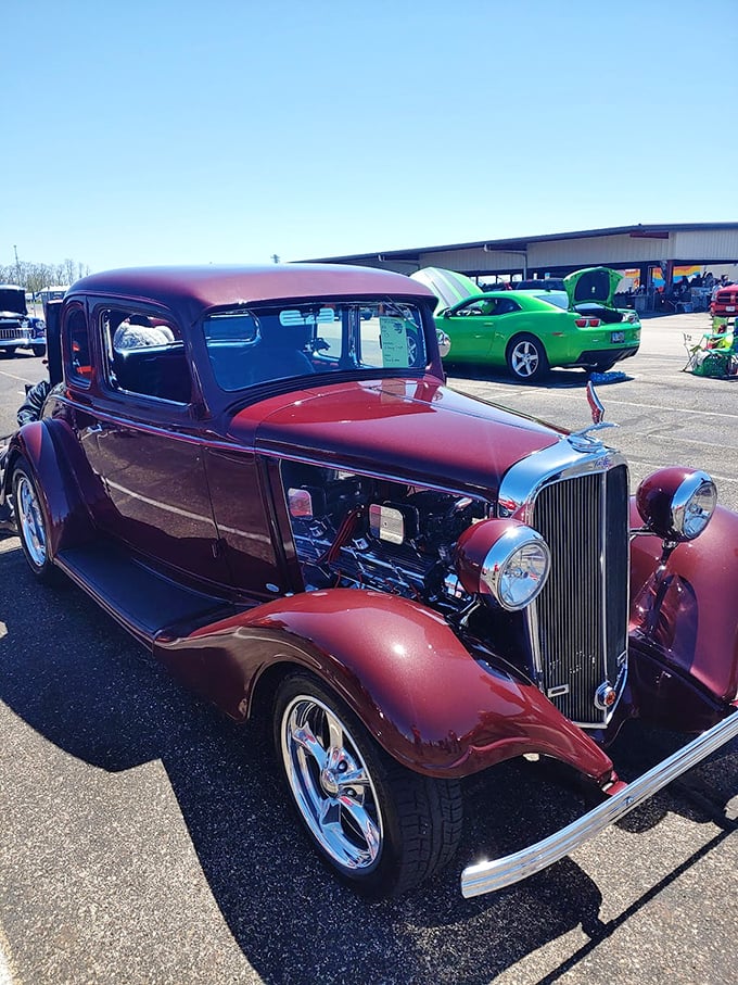Detroit's golden era gleams in this cherry-red beauty. This meticulously restored classic isn't just a car—it's a time machine on chrome wheels.