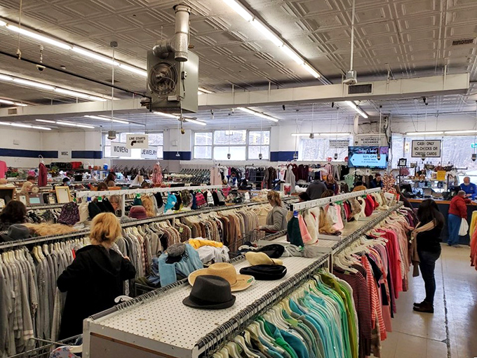 Treasure hunters navigate the well-organized aisles with purpose. Every rack holds potential for that perfect "I can't believe I found this" moment.