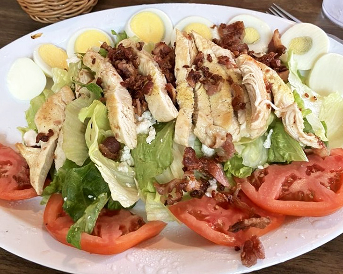 This isn't just a Cobb salad—it's a masterpiece of protein and freshness that somehow makes eating healthy feel like cheating.