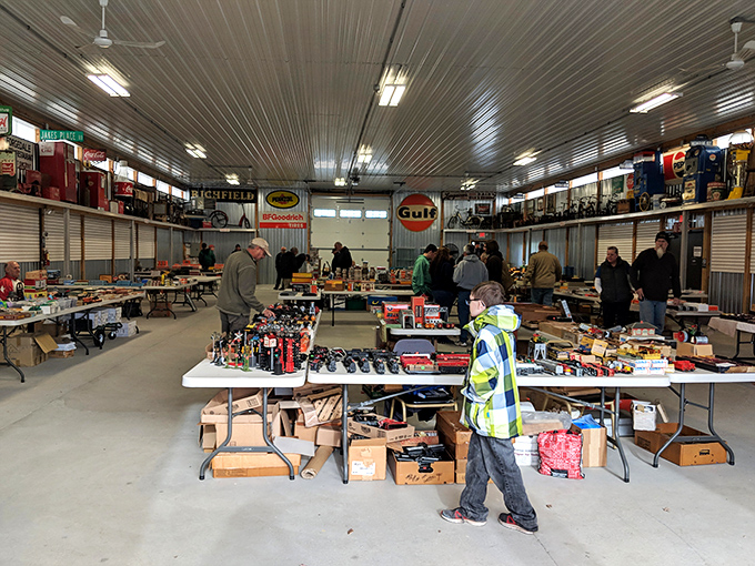 Vintage signs and automotive memorabilia transform this indoor space into a museum where everything has a price tag.