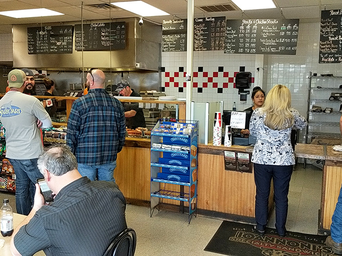 The ordering counter: where dreams are spoken aloud and transformed into edible reality by sandwich artisans who know their craft.