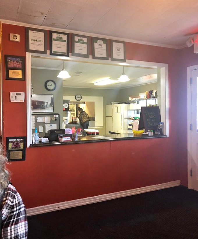 Behind this window is where the magic happens—no fancy chef's table needed when the food speaks volumes without the theatrics.