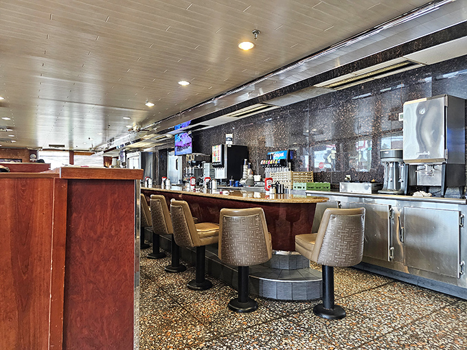 The counter—where solo diners find community, coffee flows eternally, and breakfast philosophies are exchanged like currency.