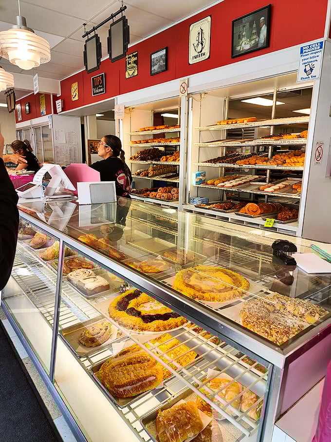 This bakery case isn't just displaying pastries—it's showcasing edible works of art that make choosing just one a delicious form of torture.
