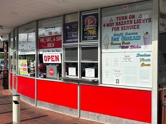 The ordering window – where dreams and hunger meet. Those red panels have witnessed generations of "I'll have the usual" conversations.