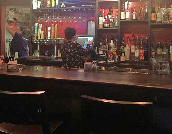 Behind the bar, where liquid happiness is crafted with the same care as the food. Cocktails that don't just accompany burgers—they celebrate them.