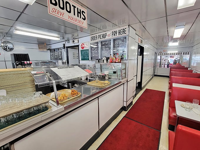 The counter at K's tells stories of first dates, business deals, and Saturday morning traditions. That red runner adds just the right touch of mid-century charm.
