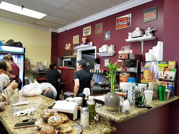Vintage signs and collectible teapots line the walls—not as calculated decor, but as artifacts from a life well-lived in food service.