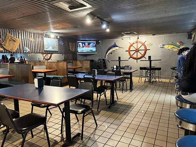 Ship wheels and mounted fish create the perfect backdrop for seafood feasting. No interior designer needed when you've got authentic maritime charm.