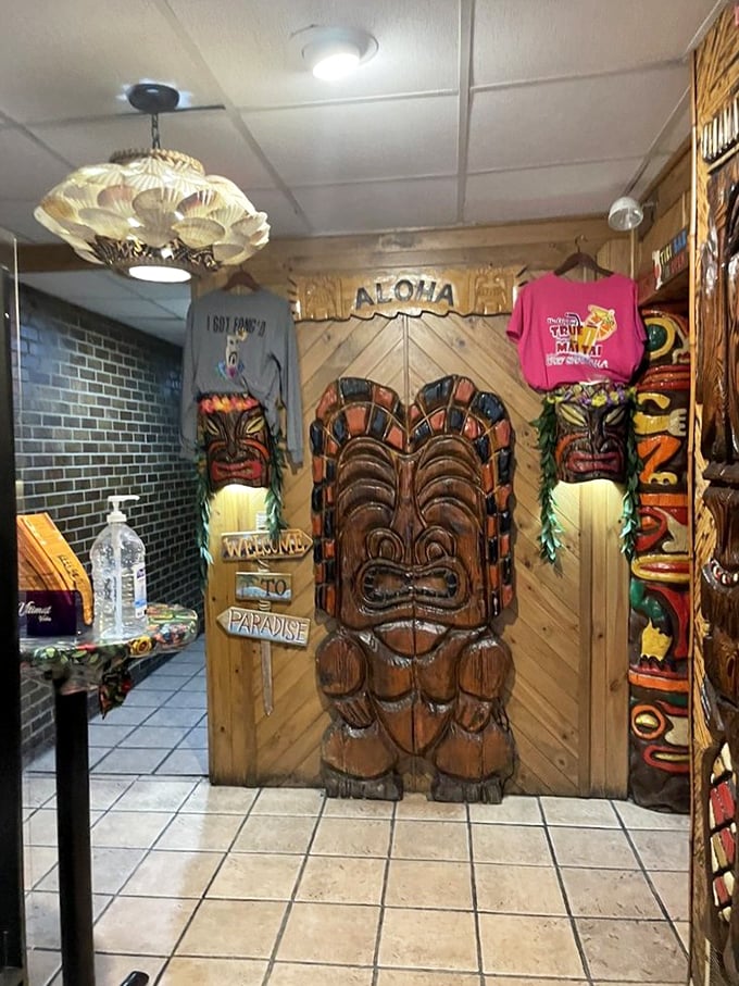The entrance to the restrooms? No, the gateway to Polynesia. These carved tikis have seen things—mostly happy diners returning from the buffet.