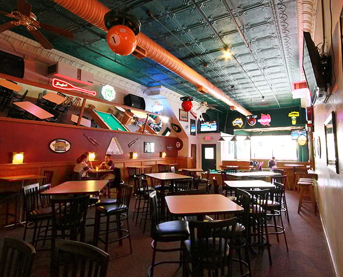 Vintage-inspired décor and exposed ductwork create that perfect "industrial chic meets neighborhood joint" atmosphere that feels instantly familiar.