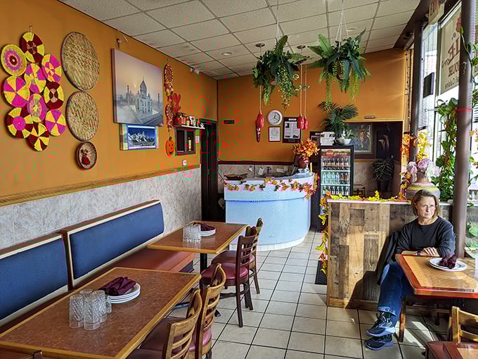 Colorful wall decorations and hanging plants transform a simple space into something special—like the culinary equivalent of "come as you are."