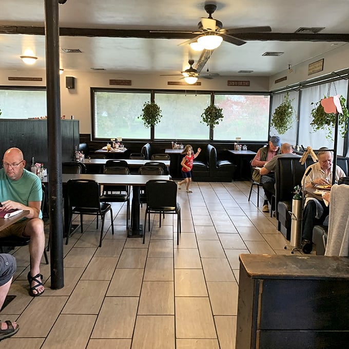 Where strangers become neighbors over coffee refills and pie. The hanging plants aren't just decor—they're longtime witnesses to local gossip.