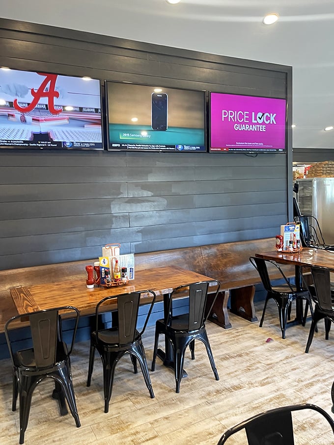 Modern coastal cool meets practical dining. Those wooden tables have probably witnessed more seafood euphoria than a fisherman's diary.