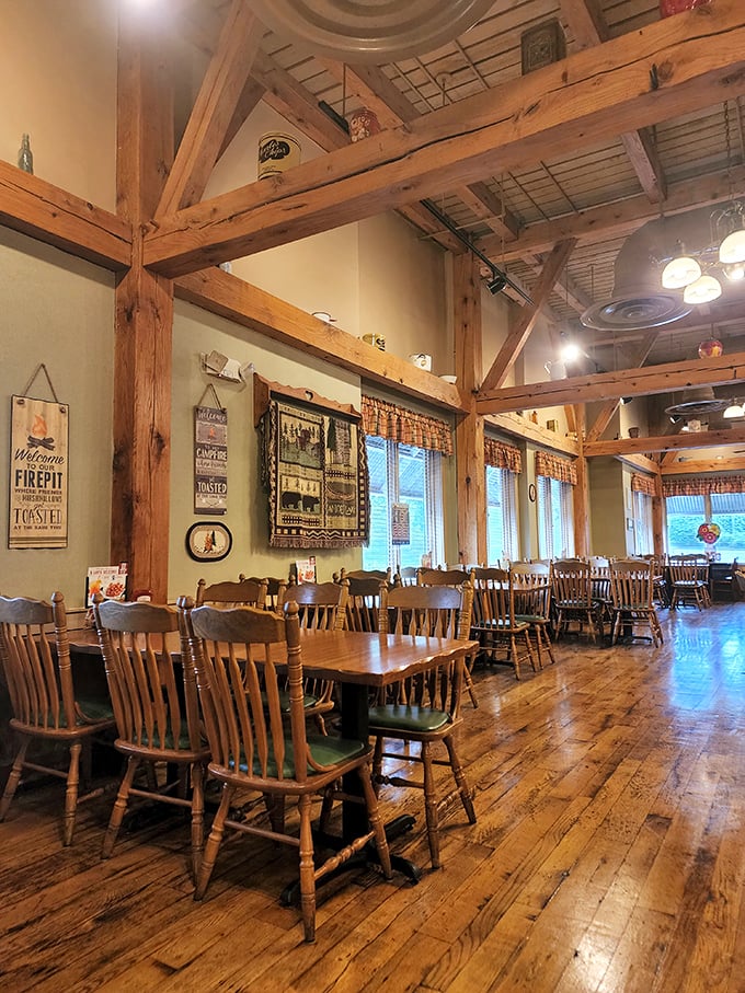 Exposed wooden beams and farmhouse charm create a dining atmosphere that feels like you've stepped into a cozy country kitchen.