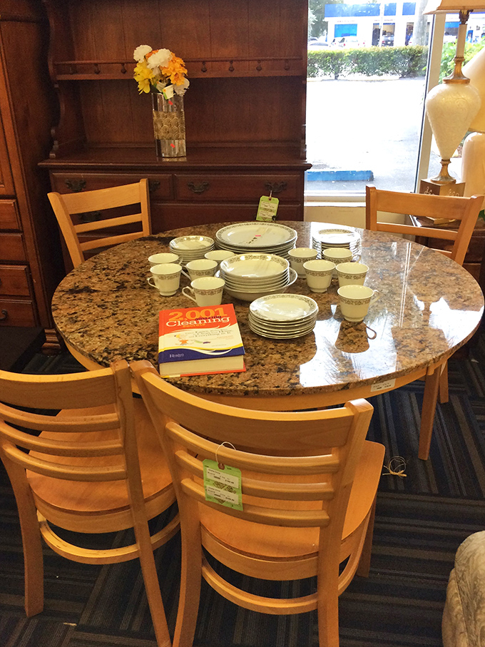 This granite dining set with matching china is just waiting for its next dinner party. The cookbook suggests it's ready for some culinary adventures.