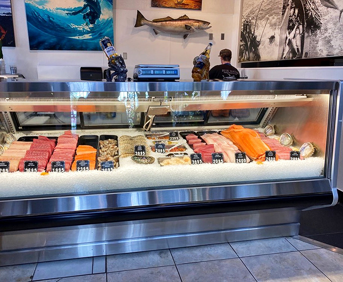 The display case—where seafood dreams begin. This gleaming showcase of ocean treasures lets you point to your destiny before it's transformed into your perfect meal.