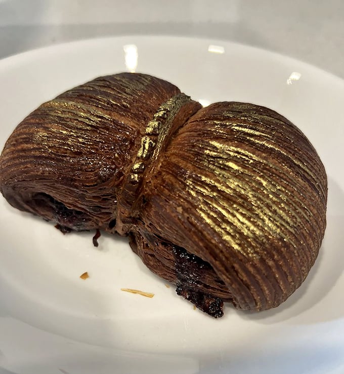 Chocolate on chocolate with raspberry playing referee. This croissant doesn't just break rules; it rewrites the pastry playbook entirely.