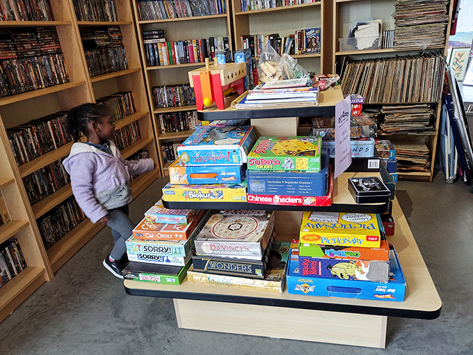 Board games stacked high, promising family fun nights without the retail price tags that make you lose before playing.