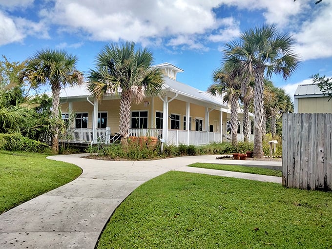 Florida vernacular architecture at its finest – a wraparound porch that practically demands you sit a spell with a cold beverage and zero agenda.