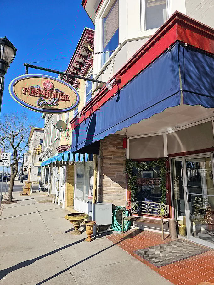 The Firehouse Grill's inviting storefront promises comfort food that fights hunger with the same dedication firefighters battle blazes.