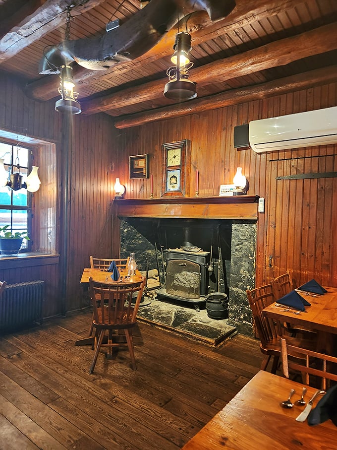 The tavern's original fireplace isn't just for show—it's the beating heart of a dining room where countless stories have been shared over centuries of meals.