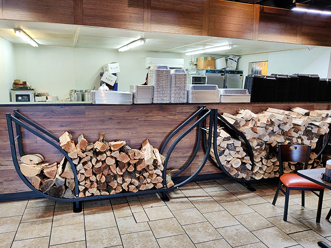 Stacked firewood isn't just decoration—it's a promise. Each log represents hours of slow-smoking magic that transforms ordinary meat into extraordinary memories.