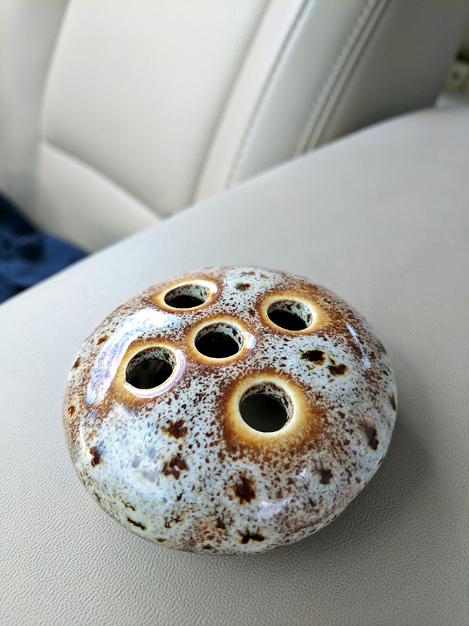 What looks like lunar pottery is actually a flower frog—the unsung hero of 1950s floral arrangements and today's collector obsession.