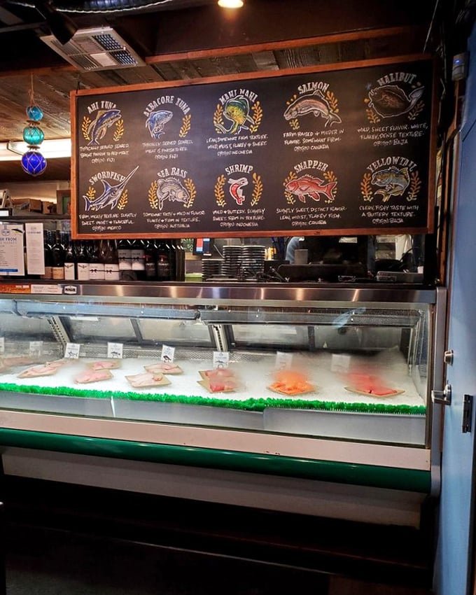 The seafood display case and chalkboard menu—where today's catch becomes tonight's dinner in a beautiful circle of deliciousness.