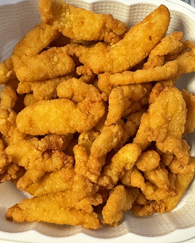 These golden-fried clam pieces aren't just food—they're little nuggets of oceanic joy. Crispy outside, tender inside, happiness throughout.