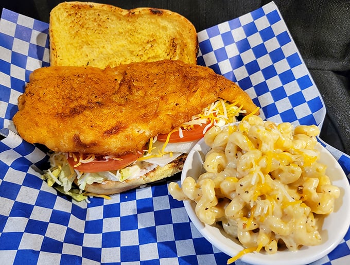 A fish sandwich that doesn't play second fiddle to the barbecue—it demands respect with golden breading and a side of mac that's pure comfort.