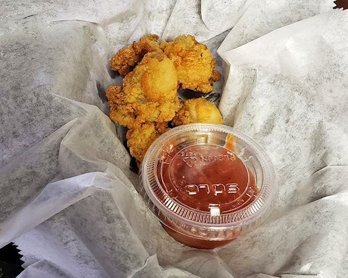 Golden-battered treasures from the Chesapeake, served with a dipping sauce that should be bottled and sold as liquid happiness.