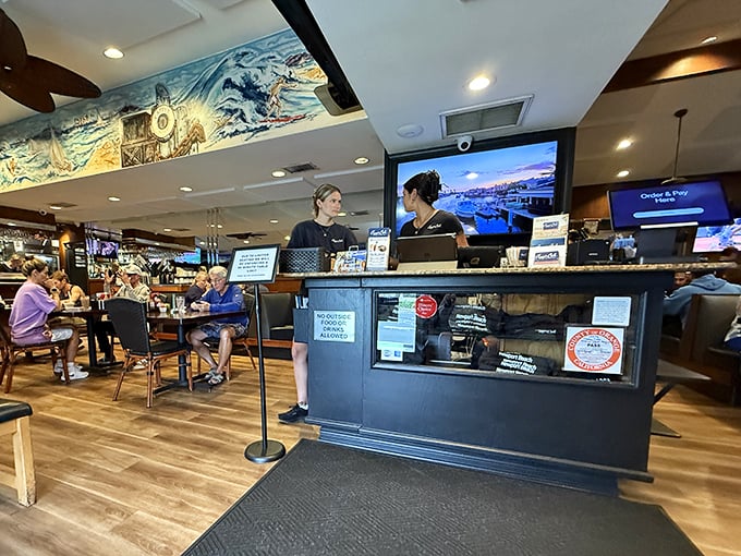 The heart of operations – where orders are called, coffee is poured, and the rhythm of a well-loved restaurant plays out all day long.