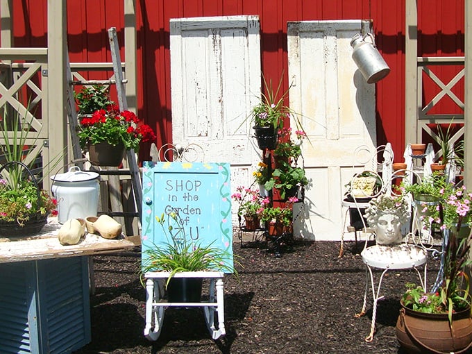 "Shop in the Garden" isn't just a sign—it's an invitation to discover treasures among the blooms. Even the chairs have stories to tell.