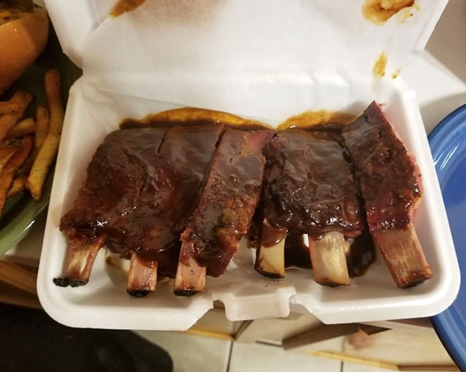 Ribs displaying that perfect "tug" between falling off the bone and staying put. The meat's mahogany exterior is barbecue's equivalent of a perfect tan.
