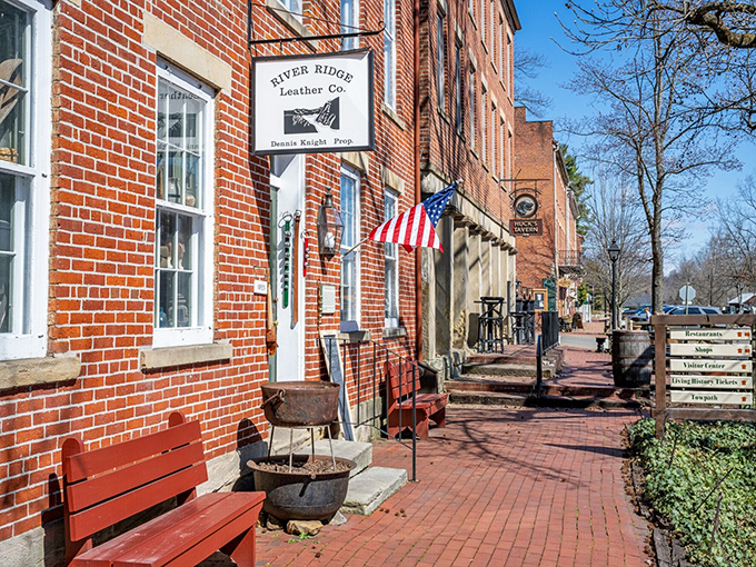 Red brick, American flags, and rocking chairs outside River Ridge Leather Co.—some shopping experiences can't be replicated on Amazon.