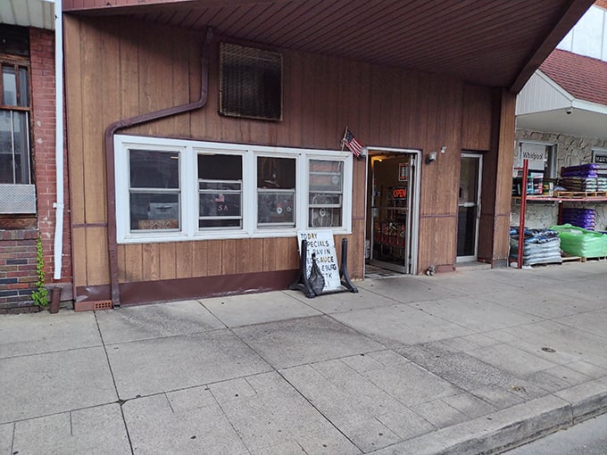 Hollywood Pizza's modest storefront promises zero glamour and 100% satisfaction for those who prefer value over pretension.
