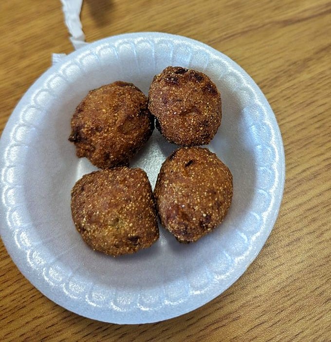 Hush puppies so good they'll make you want to keep quiet about finding this place—crispy outside, tender cornbread inside.