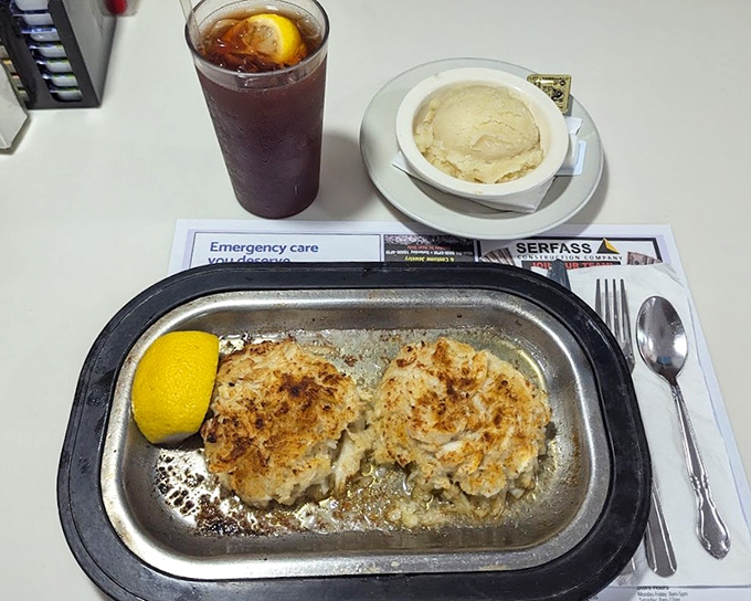 Crab cakes that actually taste like crab – served with a lemon wedge that's not just garnish but a necessary brightening counterpoint to the richness.