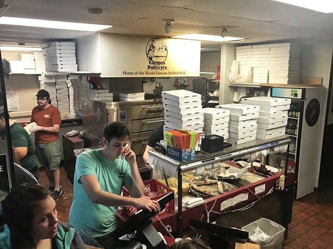 Behind the scenes where the magic happens—a bustling kitchen cranking out those famous breadsticks that have fueled countless college memories.