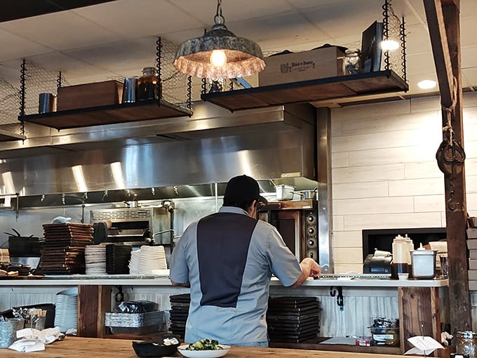 Where culinary magic happens. The open kitchen concept lets you witness the choreography of cooking – dinner and a show without the cheesy tableside flambé.
