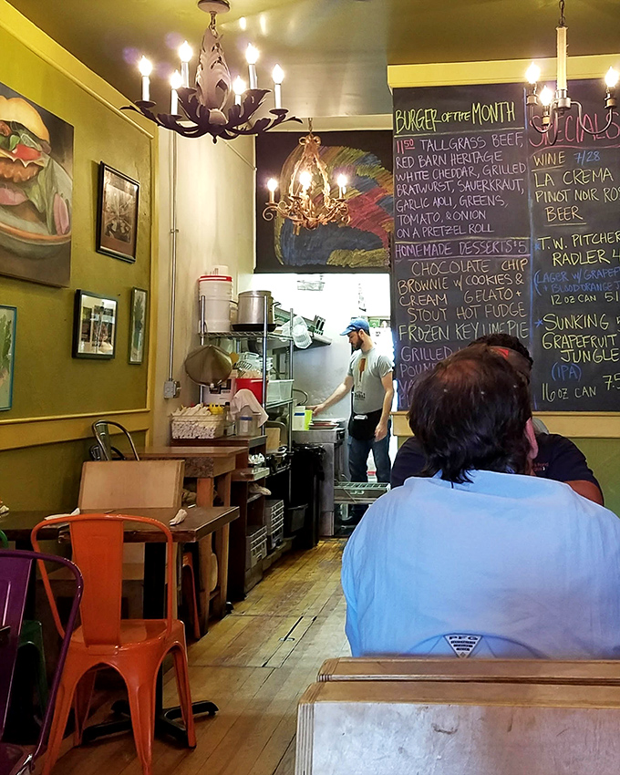 A glimpse into the open kitchen reveals the choreography behind the magic—where burger dreams become delicious reality.