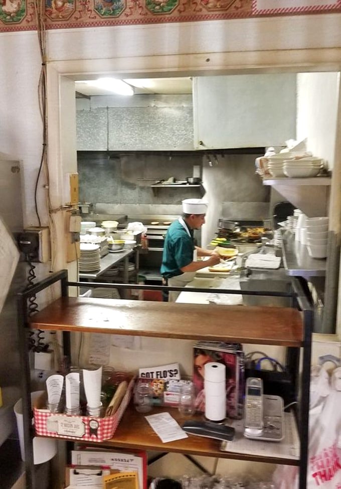 A glimpse into the kitchen where the magic happens – no molecular gastronomy here, just solid cooking skills and decades of experience.