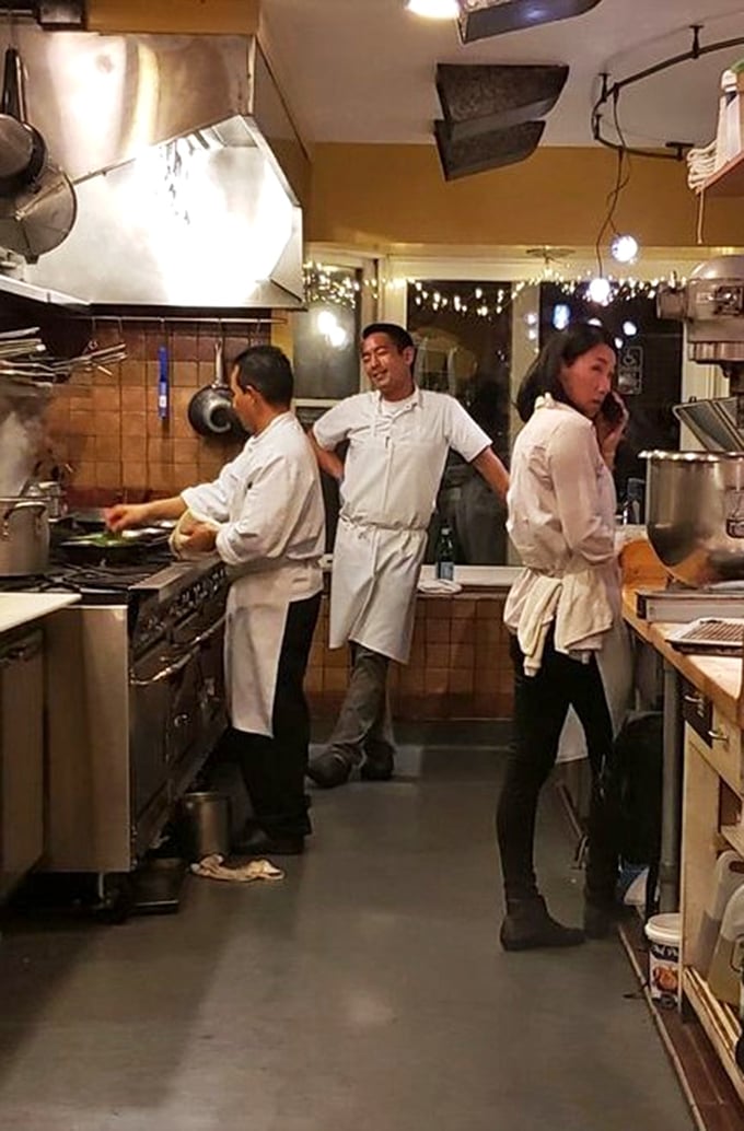 The kitchen's heartbeat—where fresh ingredients transform into memorable meals through skilled hands and focused attention.