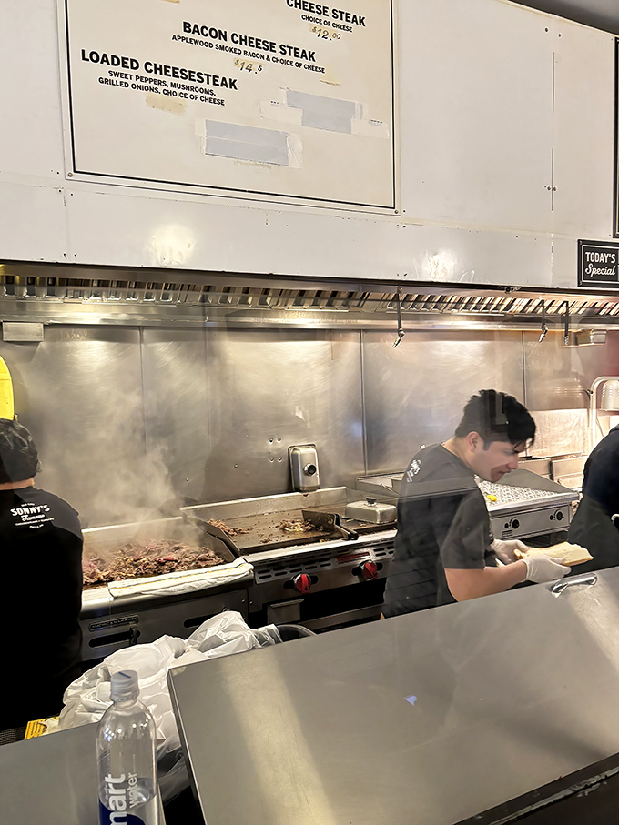 The grill – hallowed ground where thinly sliced beef transforms from merely good to transcendent. Watch closely and witness greatness.