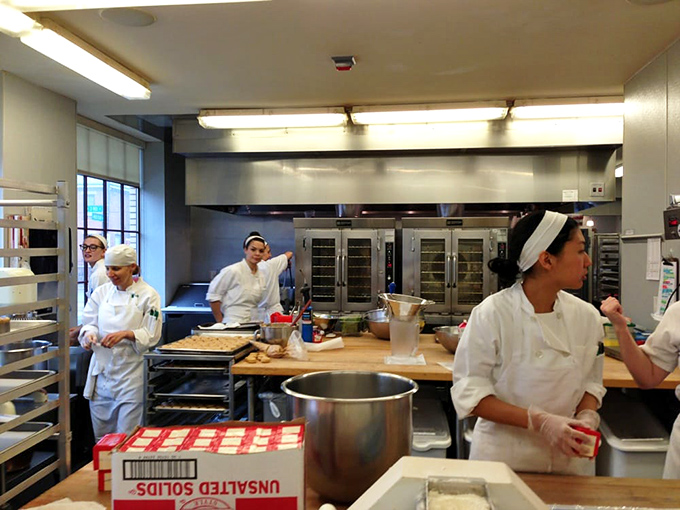 Behind the scenes, the kitchen reveals the alchemy where flour and butter transform into edible magic—proof that the best wizardry happens in white chef coats.