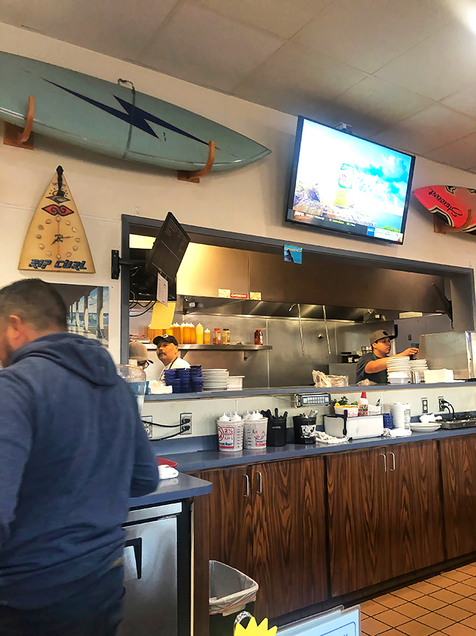 Where breakfast magic happens—surfboards watch over the kitchen like guardian angels of perfectly flipped pancakes and scrambled eggs.