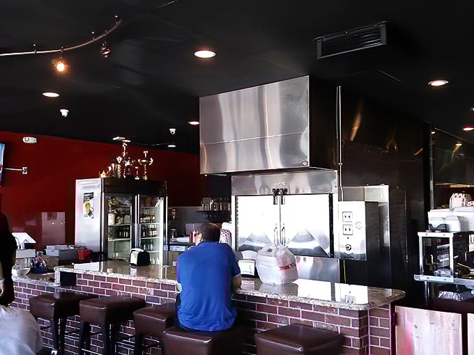 A glimpse behind the barbecue curtain where the magic happens. That brick counter separates mere mortals from the keepers of the flame.