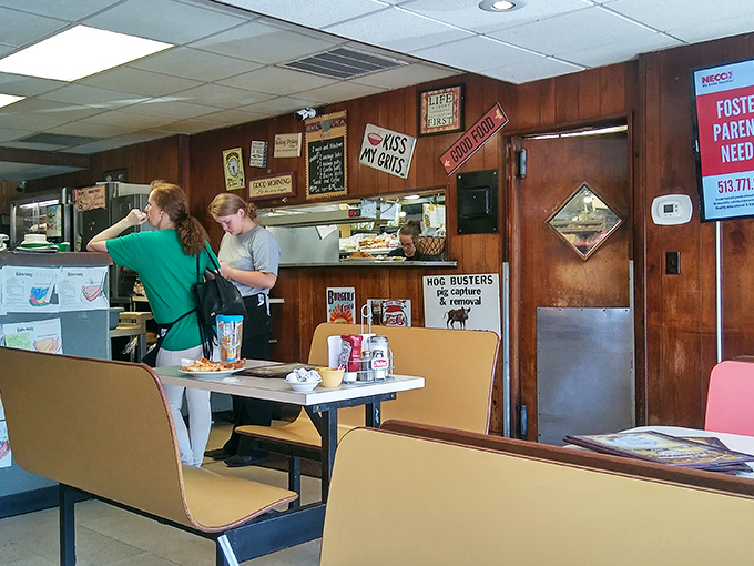 The kitchen window—where culinary magic happens and orders fly out faster than you can say "Adam and Eve on a raft." 