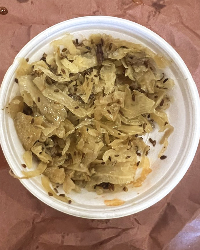 Kraut with caraway seeds—the unsung hero of barbecue sides. This tangy palate cleanser cuts through the richness like a well-timed joke at a funeral.